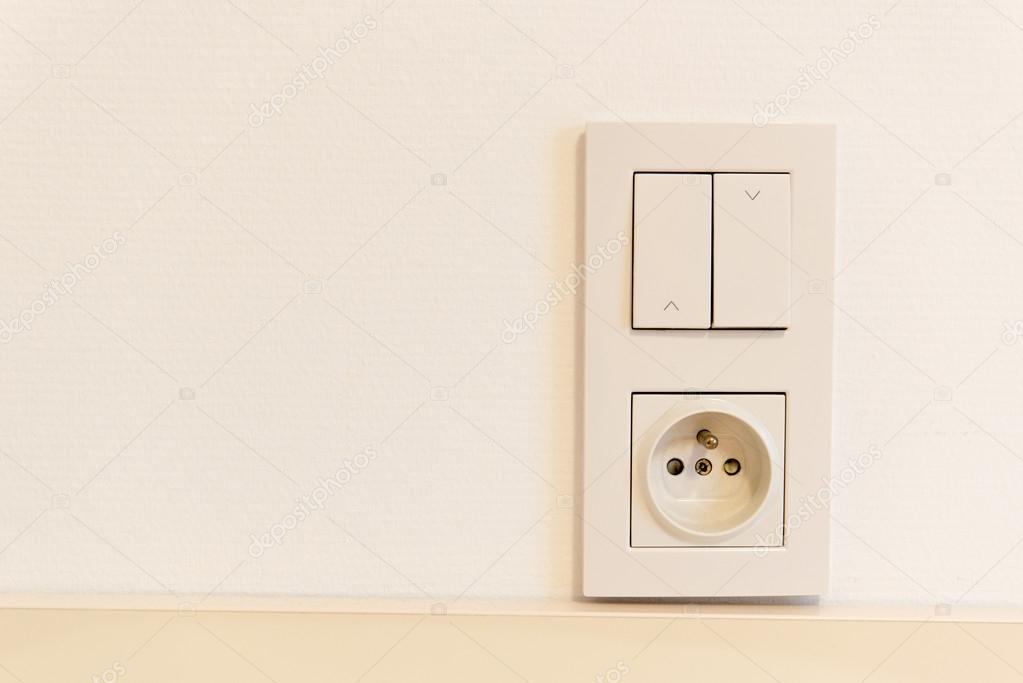 Light switch and socket in frame on the wall Stock Photo by ©tarczas ...