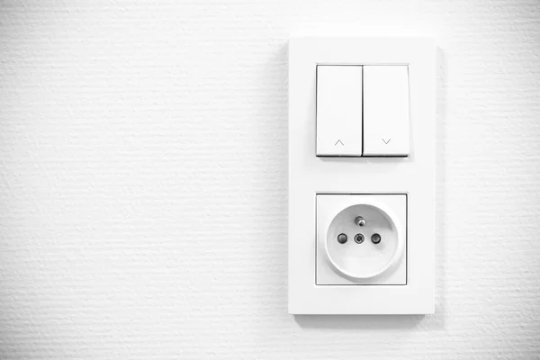 Light switch and socket in frame on the wall Stock Photo by ©tarczas ...