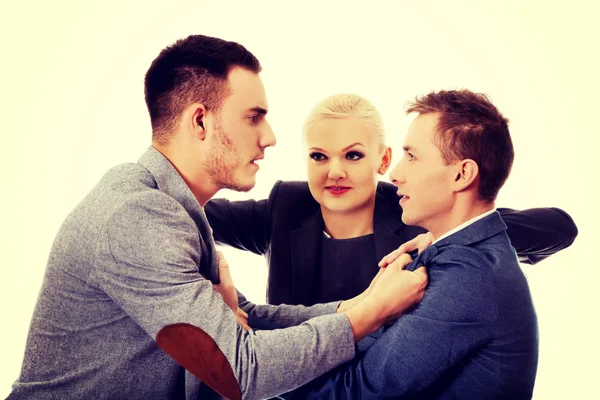 Businessmen getting into a fight woman trying to separate them - Stock ...