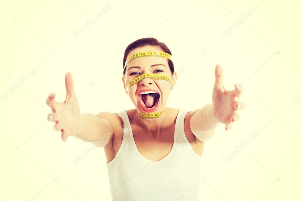 Womans face with measuring tape Stock Photo by ©piotr_marcinski 115523614