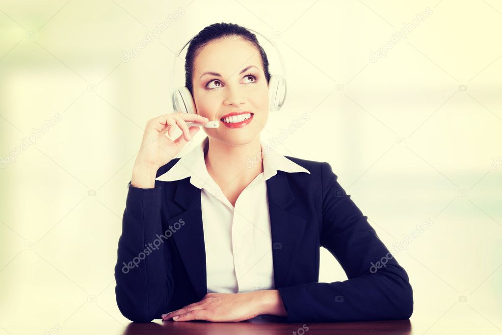 Beautiful young call-center assistant at the desk — Stock Photo © piotr ...