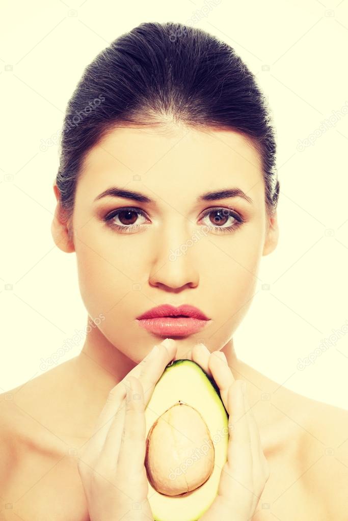 Beautiful womans face with avocado. — Stock Photo © piotr_marcinski ...