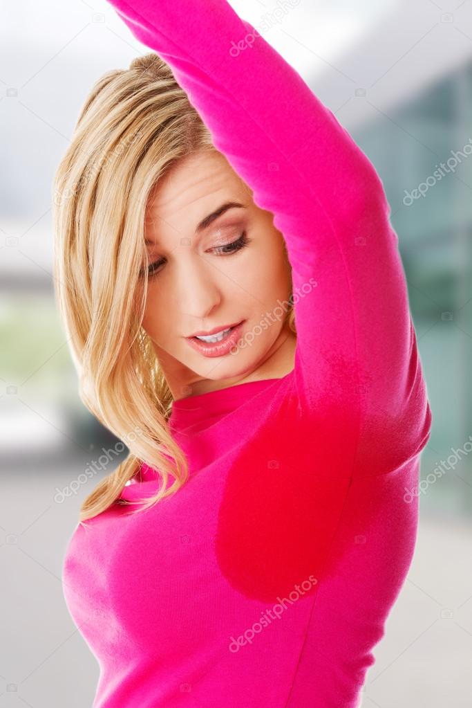 Woman having sweating problem Stock Photo by ©piotr_marcinski 61744499