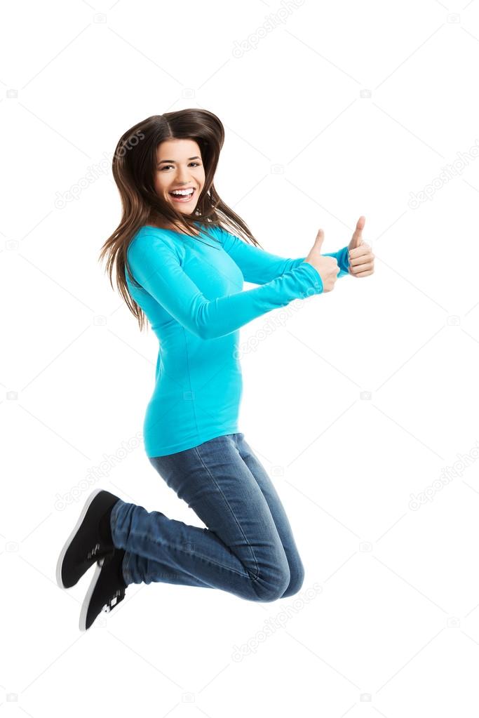 Side view happy woman jumping with thumbs up Stock Photo by ©piotr ...