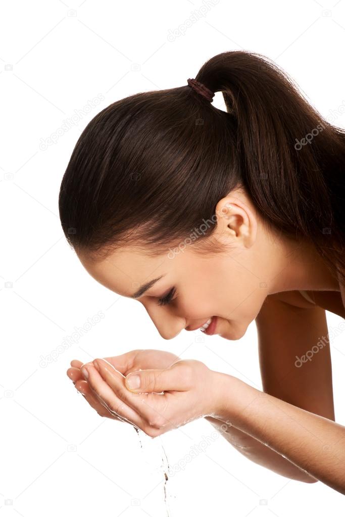 Woman washing her clean face. Stock Photo by ©piotr_marcinski 74082077