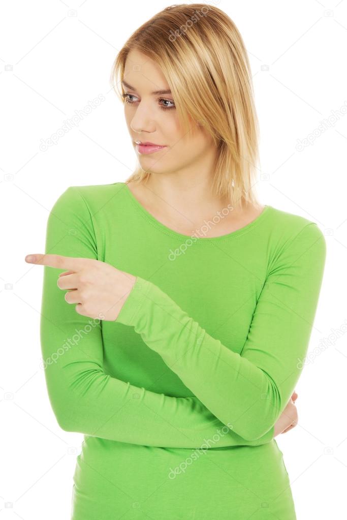 Beautiful woman pointing aside. — Stock Photo © piotr_marcinski #97183364