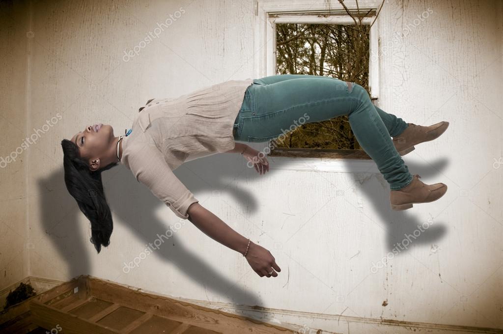 Beautiful young woman floating Stock Photo by ©robeo123 99490448