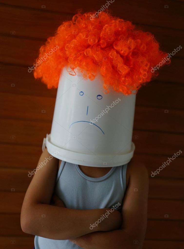 Angry boy with bin on his head Stock Photo by ©zurijeta 98285564