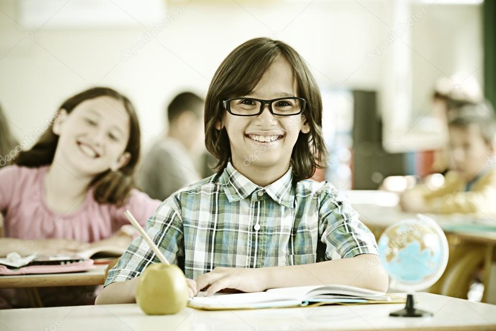 Kids at school on lessons — Stock Photo © zurijeta #98292706