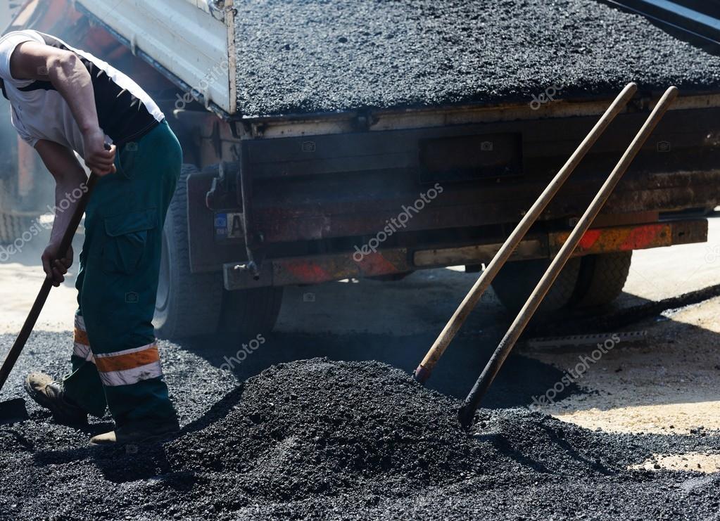 Hard work on asphalt construction Stock Photo by ©zurijeta 98568198