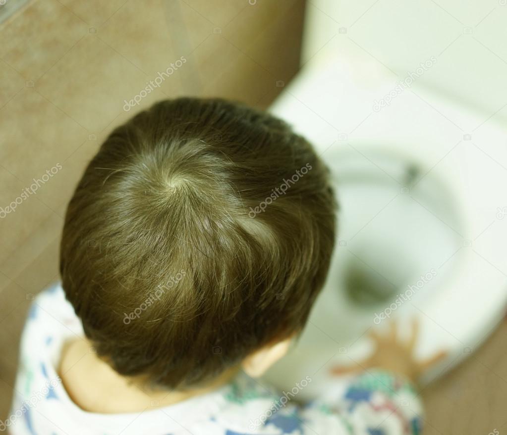 Little boy preparing to use the toilet for adults — Stock Photo ...