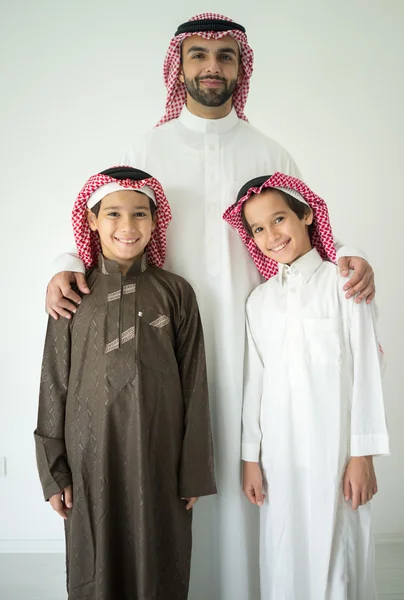 Arabic Muslim father and son standing together Stock Photo by ©zurijeta ...