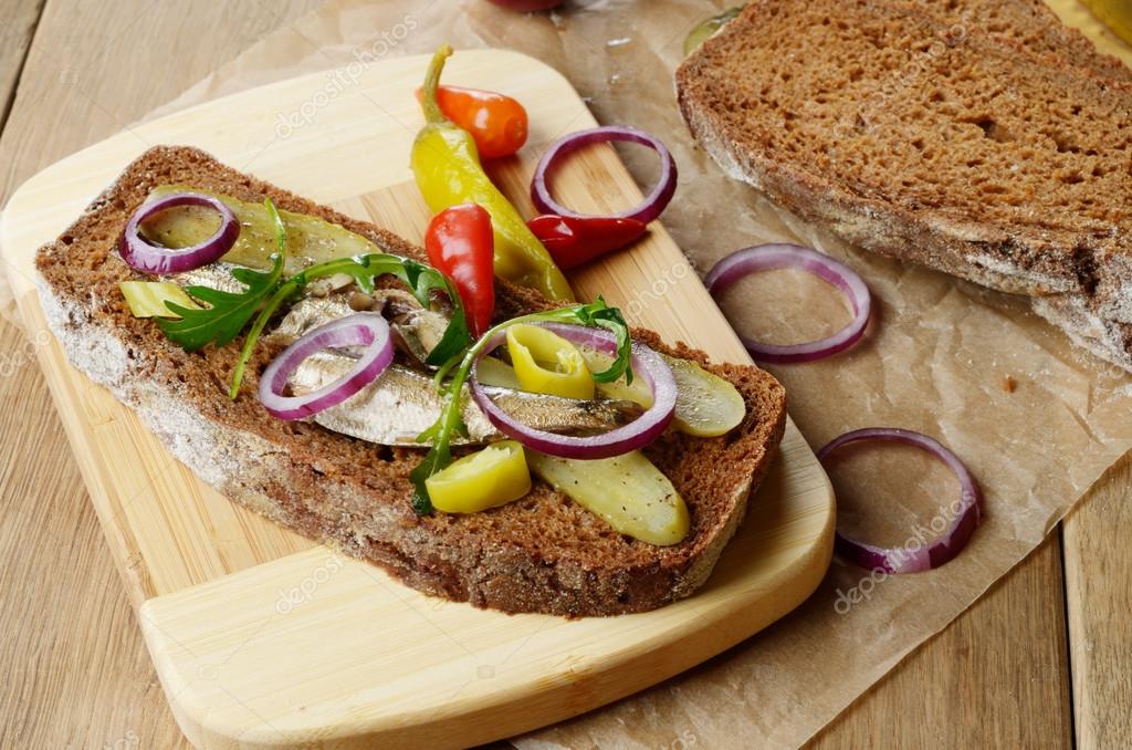 Sprat sandwich with pickled vegetables Stock Photo by ©e_mikh 55961087