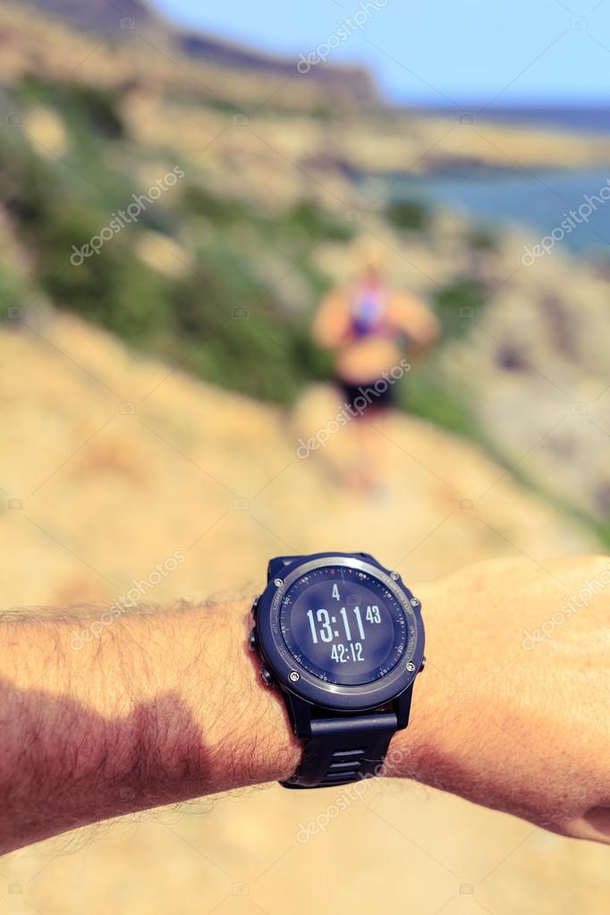 Runner looking at sport watch — Stock Photo © blasbike #74928647