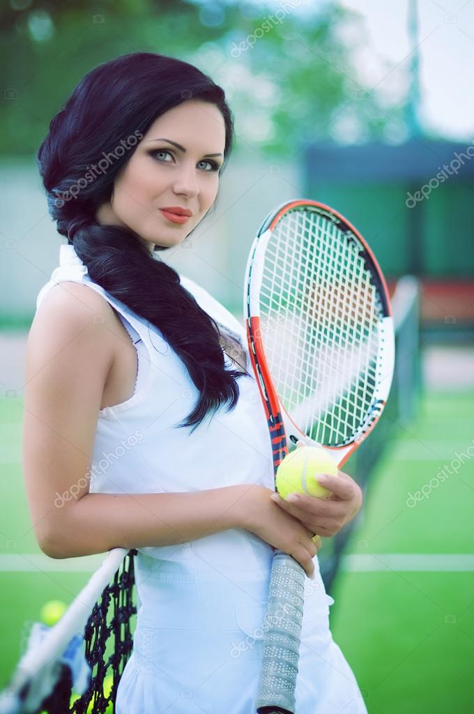Woman standing with tennis racket — Stock Photo © Forewer #55643089