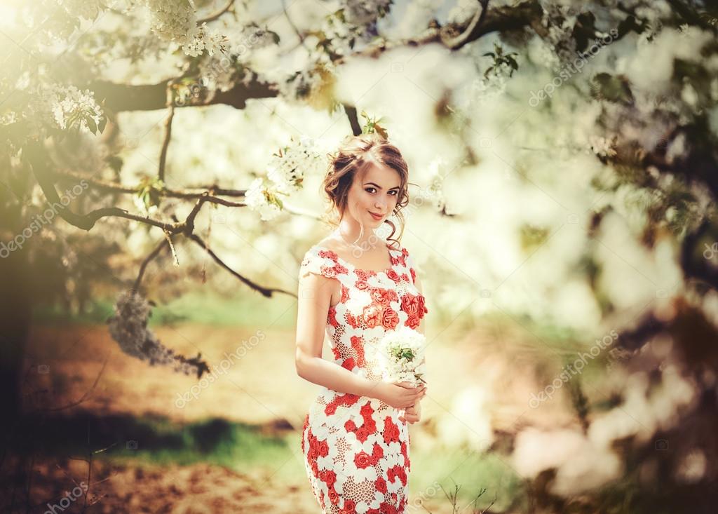 Woman posing in spring garden — Stock Photo © Forewer #88451676