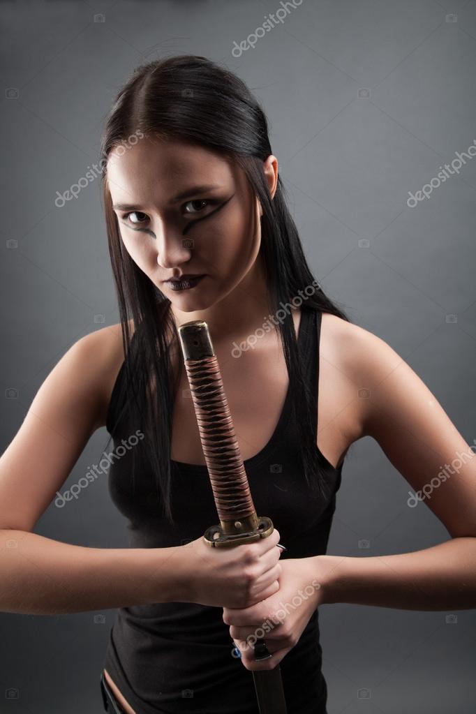 Girl with samurai sword Stock Photo by ©MomSirk 60629111