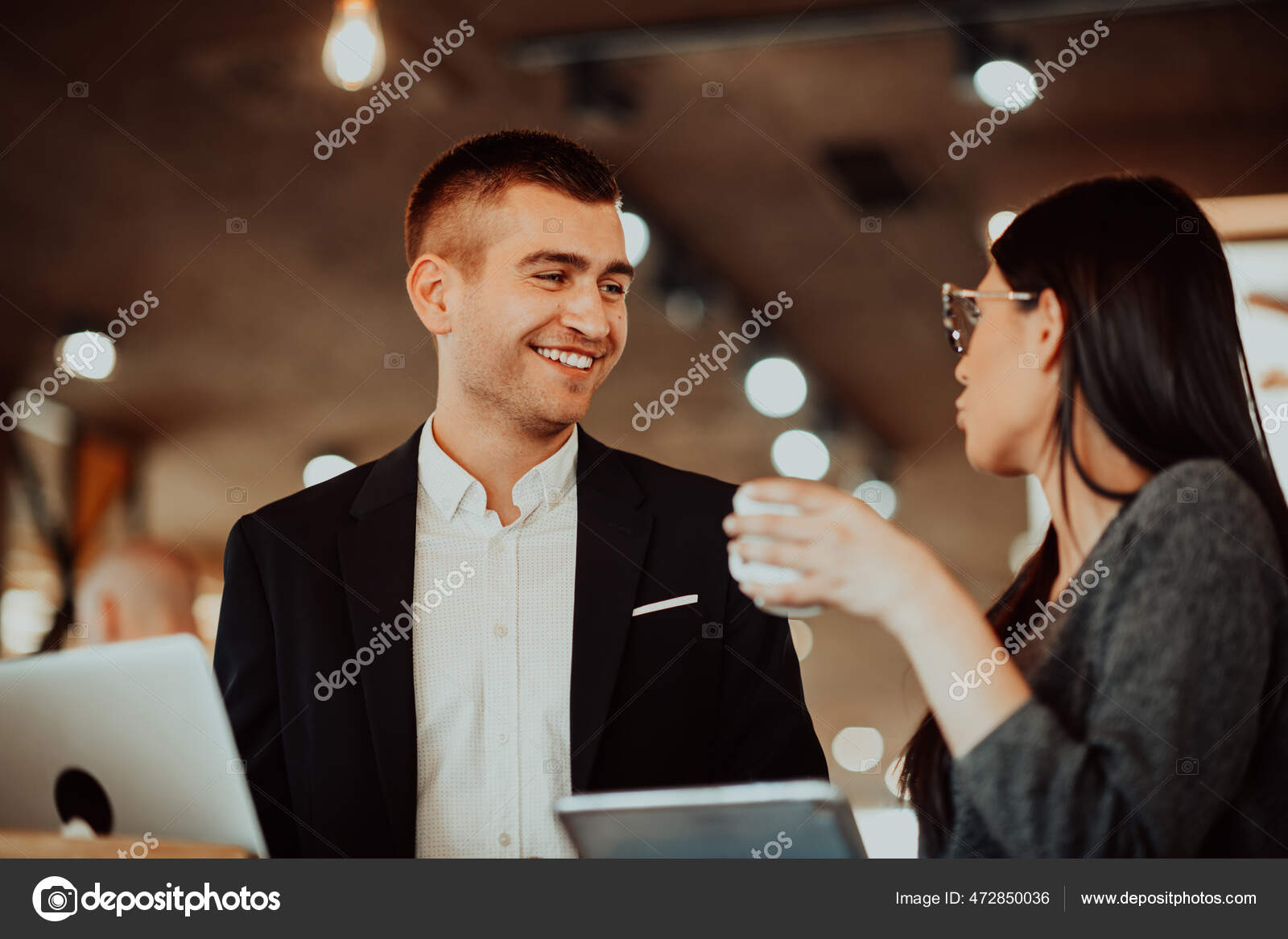 Modern man and woman use modern devices, laptop, tablet and smartphone ...