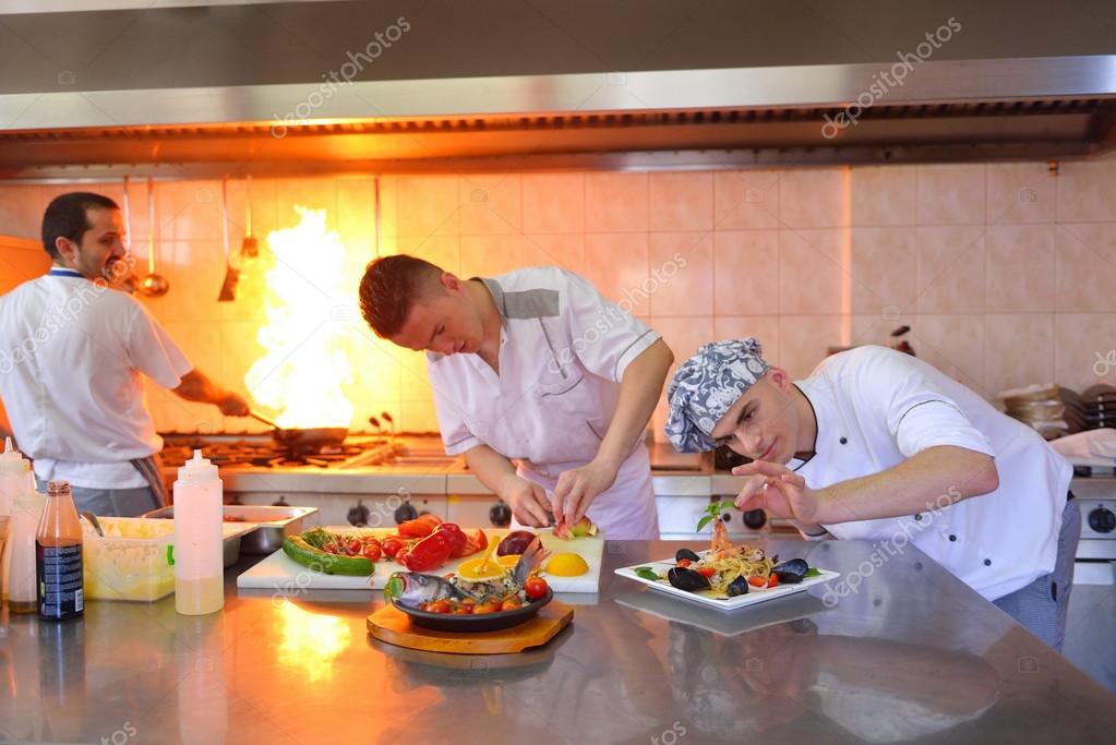 Group of handsome chefs dressed in white uniform Stock Photo by ©.shock ...