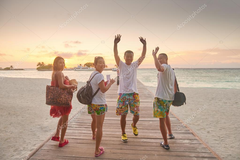 Group of friends on beautiful beach Stock Photo by ©.shock 73940173