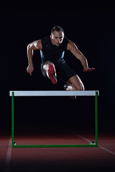 Jumping over hurdles Stock Photos, Royalty Free Jumping over hurdles ...