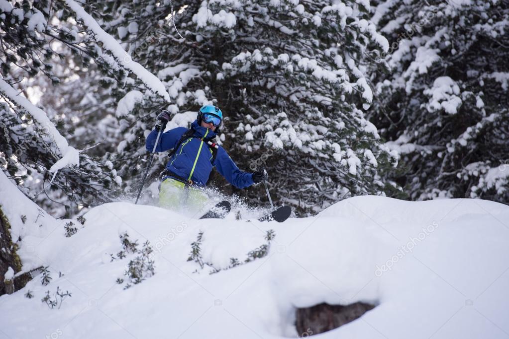 Freeride skier skiing in deep powder snow — Stock Photo © .shock #97026270
