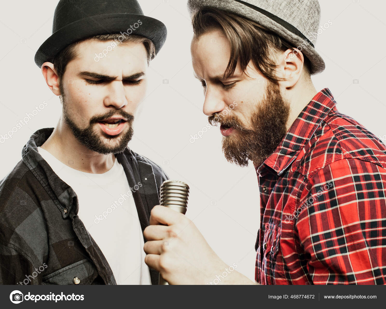 Two guys singing over white background Stock Photo by ©kanareva 468774672