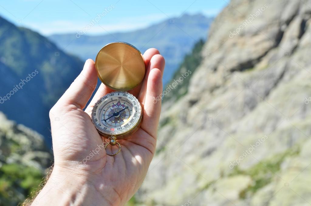 Compass in hand on nature Stock Photo by ©happyalex 82274006