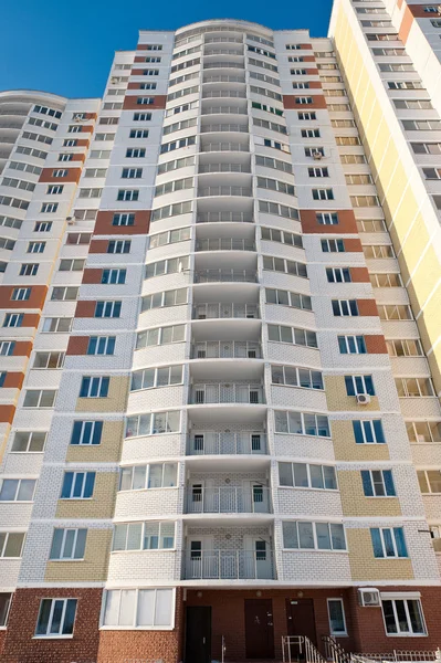 High-rise house on blue sky background - Stock Image - Everypixel