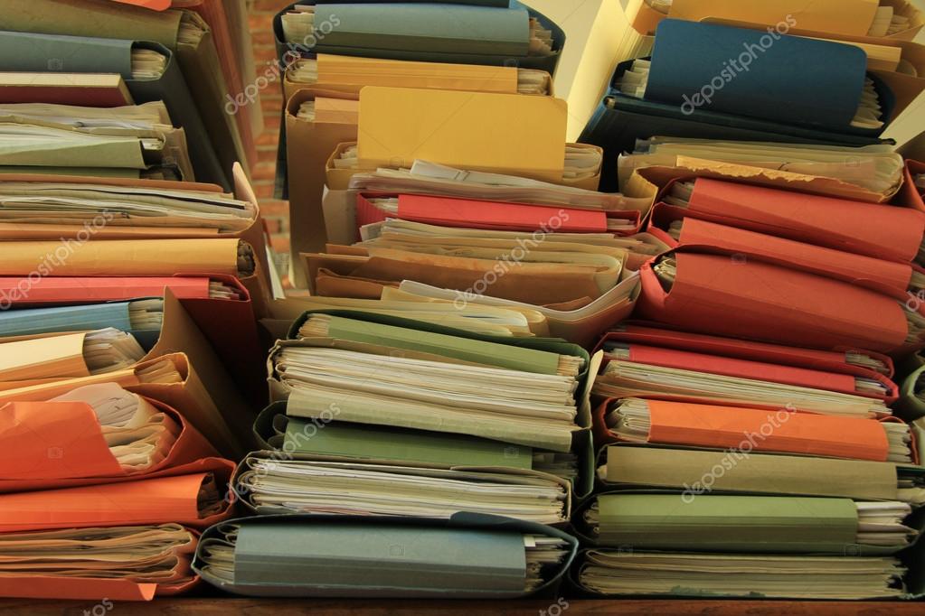 Stacked office files Stock Photo by ©portosabbia 77423642