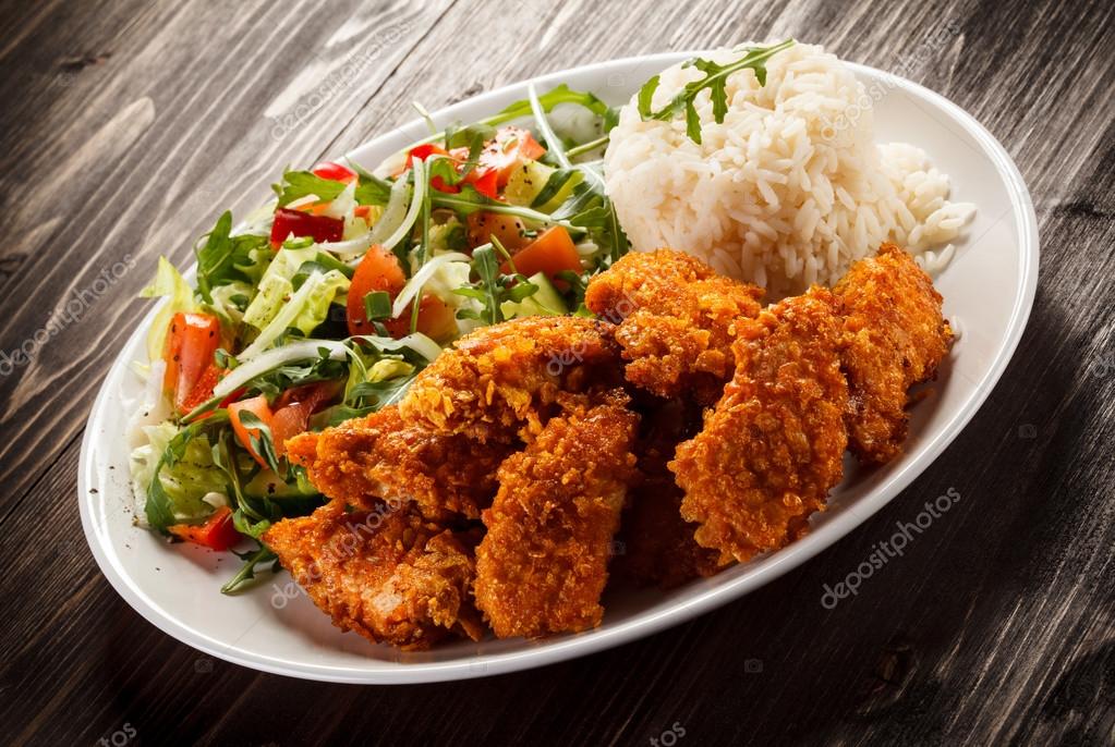 Fried chicken nuggets with rice and vegetables — Stock Photo © gbh007 ...