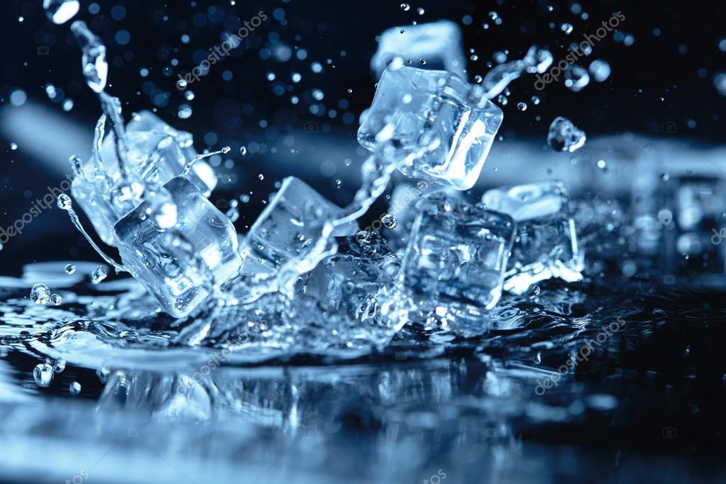 Ice cubes with water splash Stock Photo by ©strelok 100596242