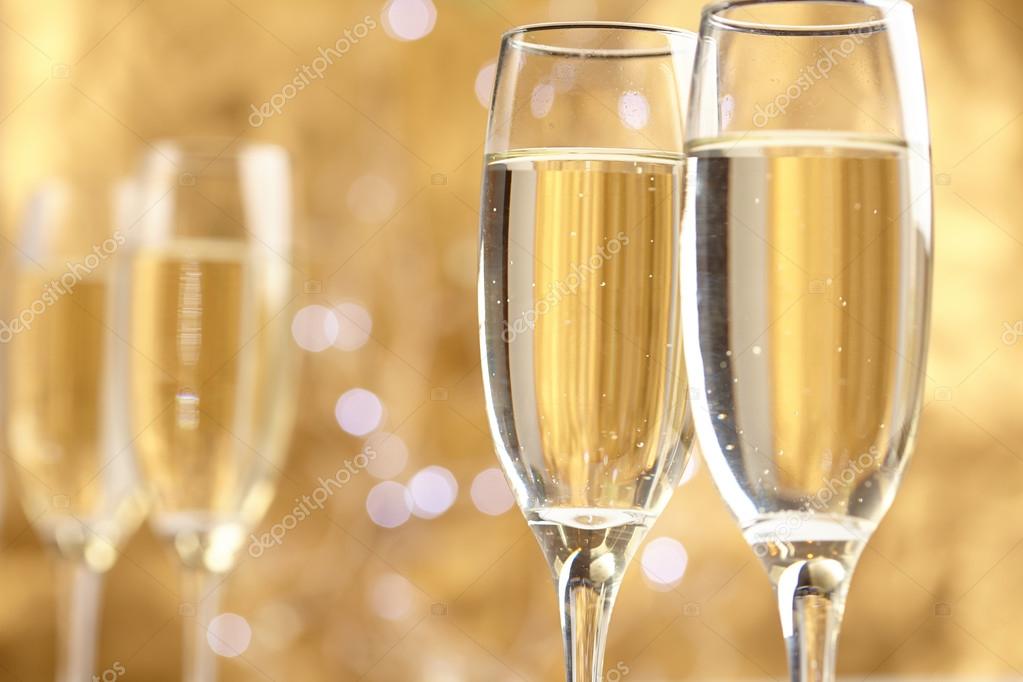 Champagne on gold background Stock Photo by ©strelok 60458271