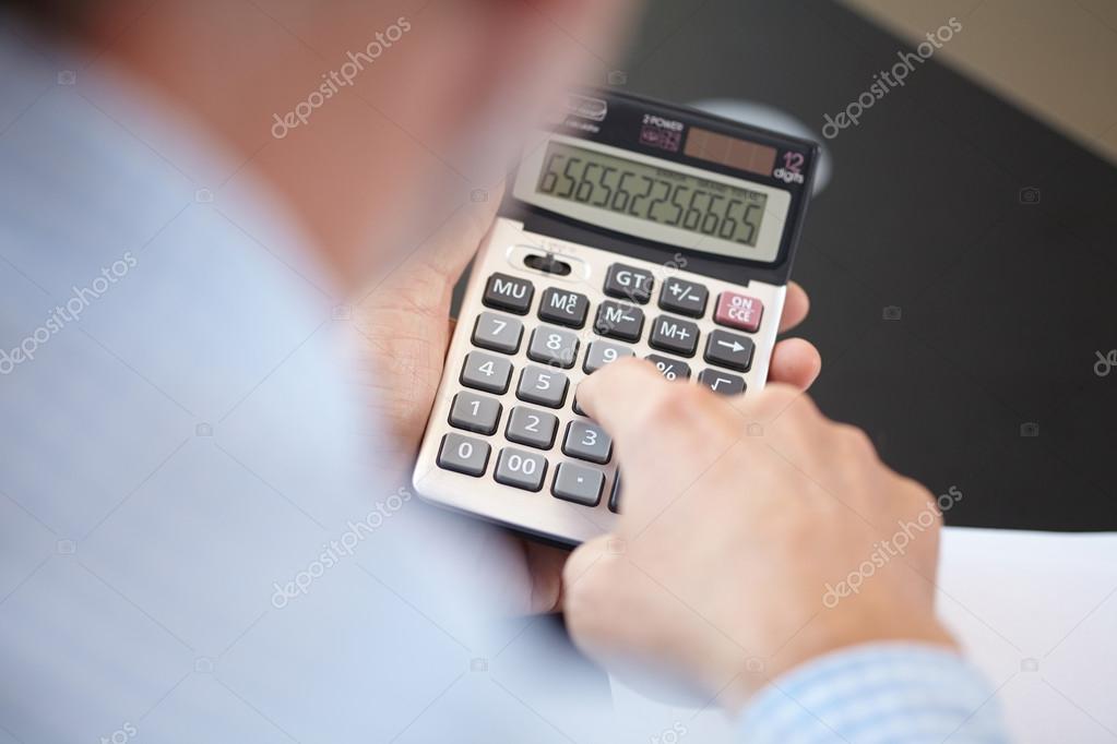 Businessman using calculator — Stock Photo © strelok #67787383 Businessman using calculator — Stock Photo © strelok #67787383