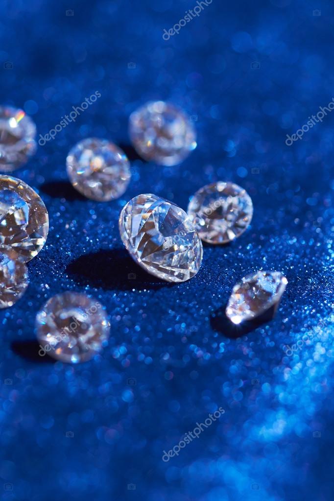Diamonds on blue background — Stock Photo © strelok #71065845