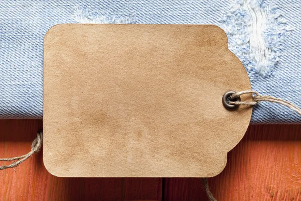 Blank paper label on jeans background — Stock Photo © digieye #117964468
