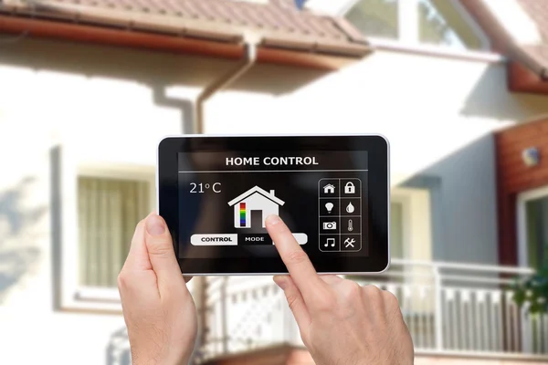 Remote home control system on a digital tablet. — Stock Photo ...