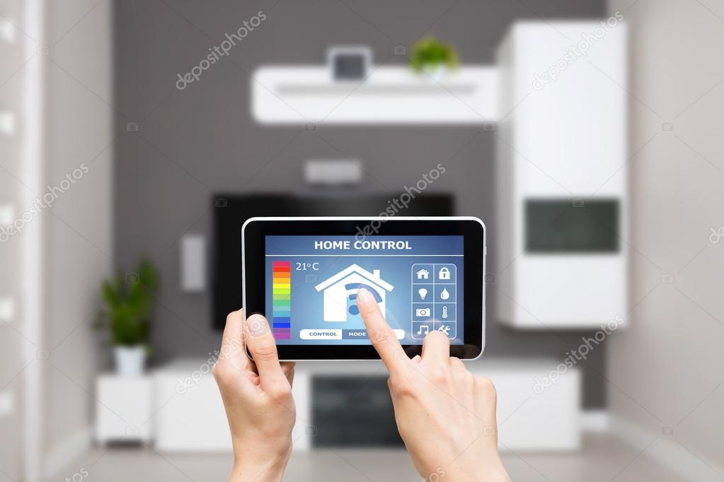 Remote home control system on a digital tablet. Stock Photo by ...