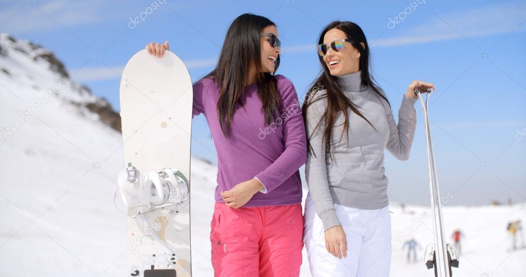 Attractive young women with snowboards — Stock Photo © dashek #100591820