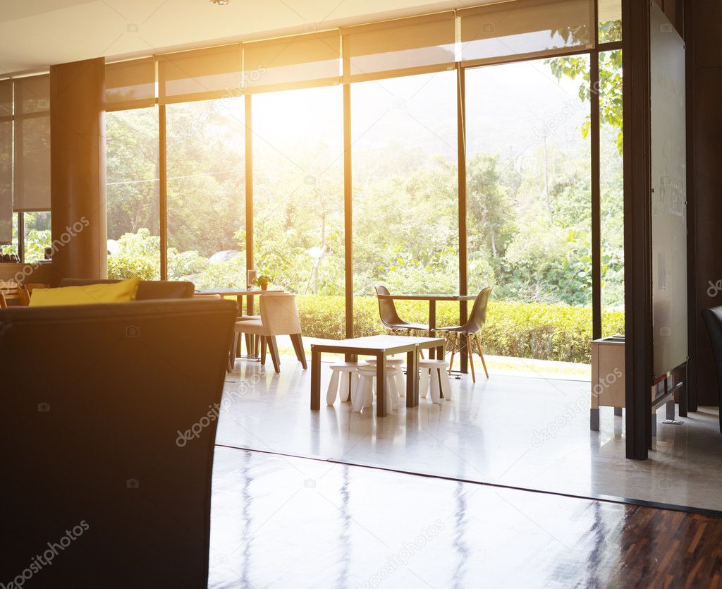 Cosy table and two chairs beside window Stock Photo by ©Ansonde 58857765