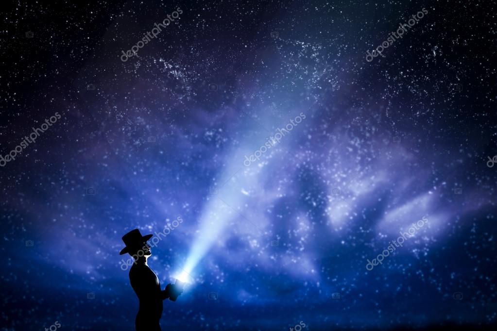 Man throwing light beam to the sky — Stock Photo © Photocreo #101502634