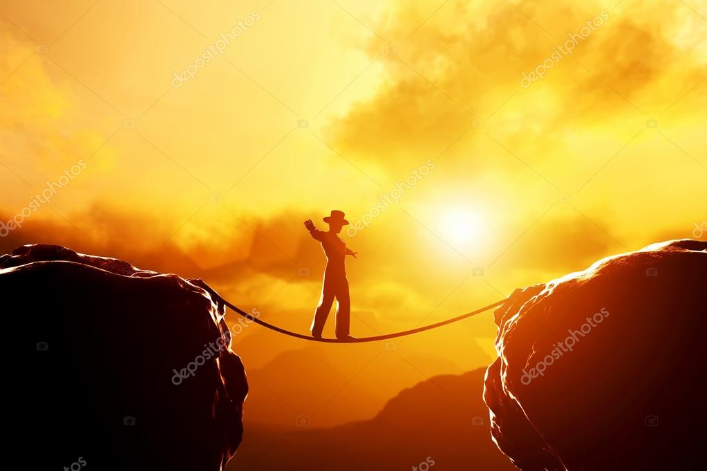 Man balancing on rope over mountains Stock Photo by ©Photocreo 58089273