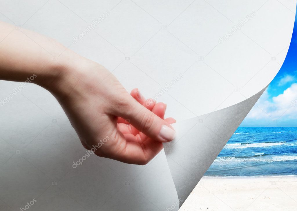 Hand pulling a paper corner — Stock Photo © Photocreo #64003127