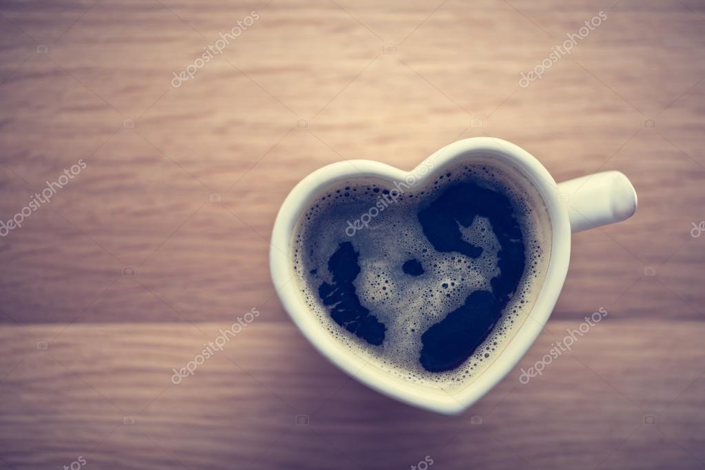 Coffee in heart shaped cup Stock Photo by ©Photocreo 92942468