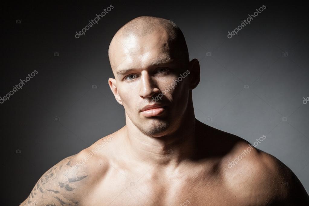 Portrait of strong man isolated on dark background ⬇ Stock Photo, Image ...