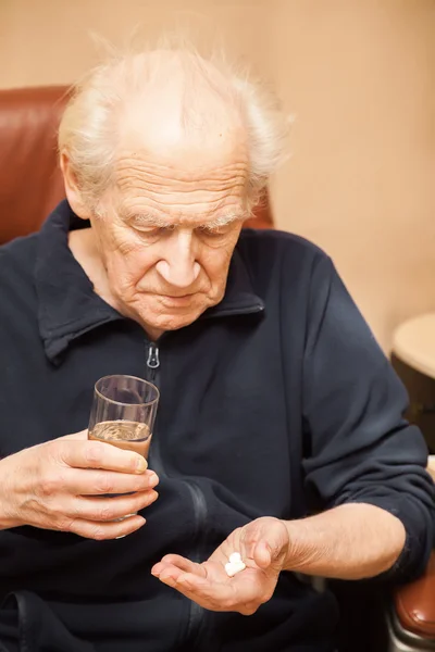 Old Man Taking Medicine — Stock Photo © Anita_Bonita #5702063