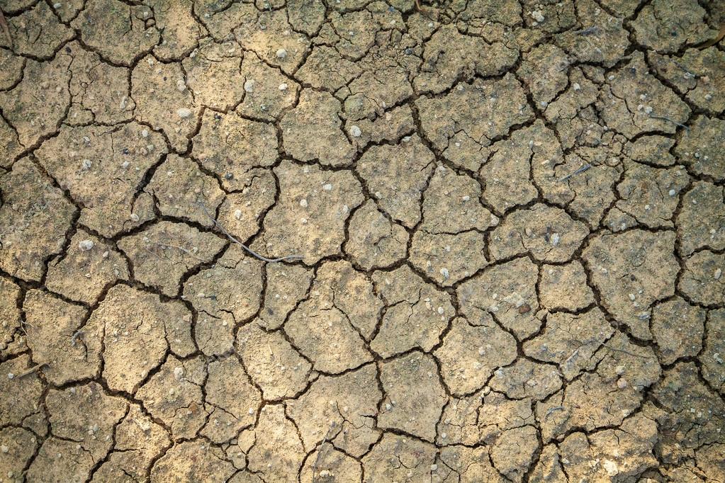 Cracked land background Stock Photo by ©Anita_Bonita 72507975