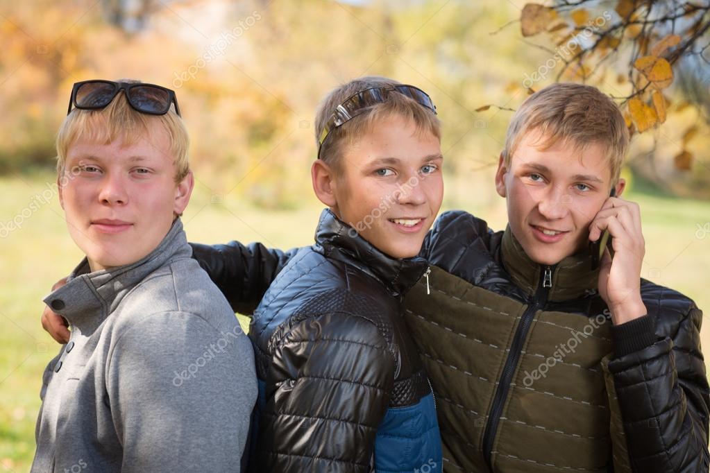 Group of guys talking in the park — Stock Photo © Stas_K #56448847