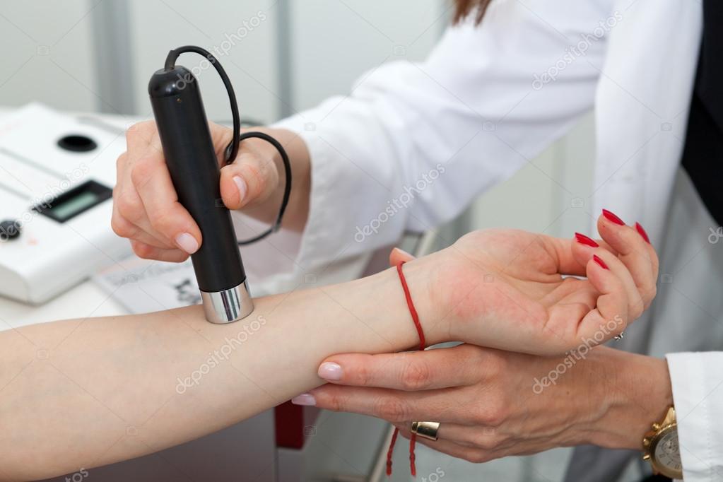 Dermatologist Examining Birthmarks And Moles On A Female Patient Stock