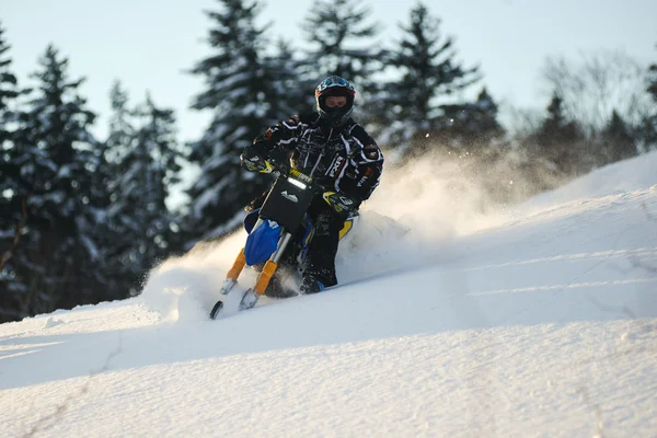 snowmobile in winter forest in the mountains of Sakhalin Island - Stock ...